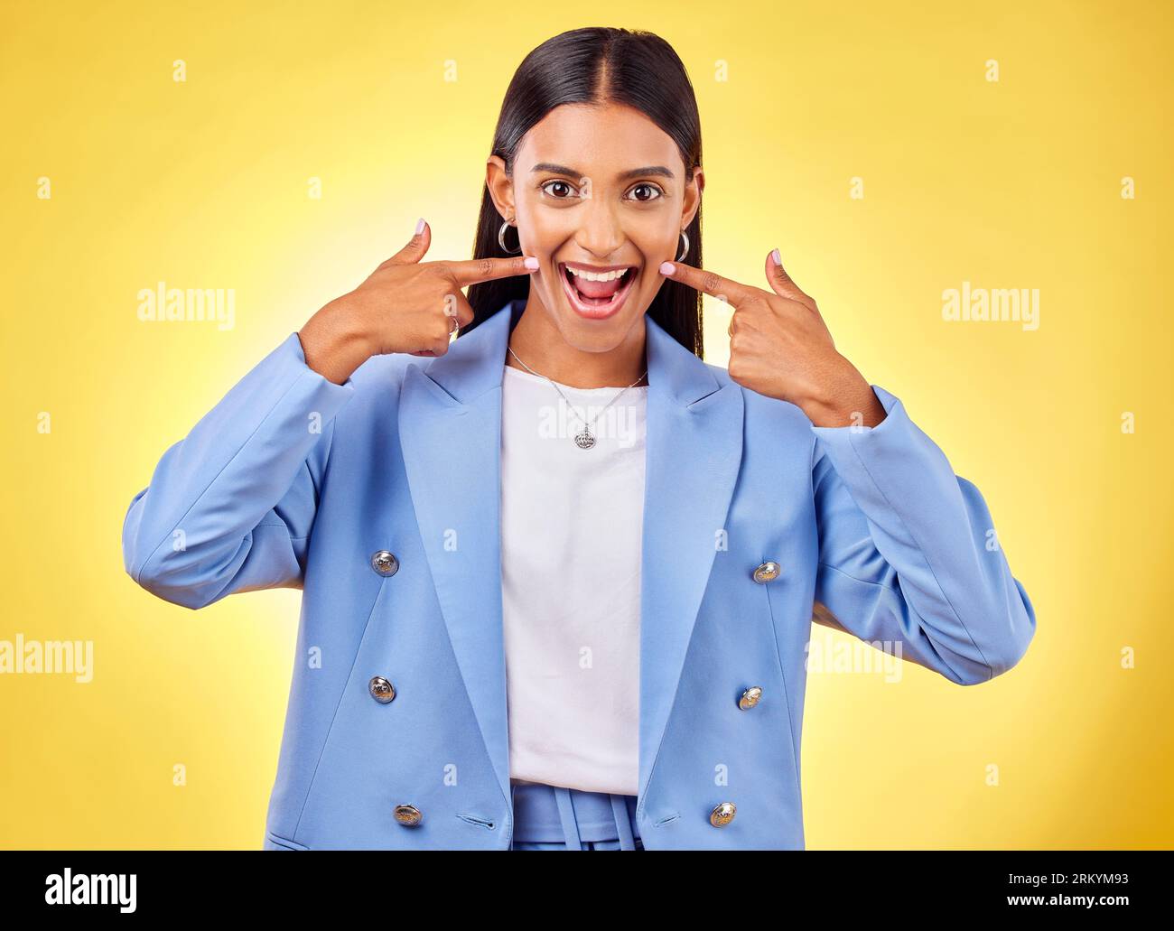 Fingers on cheek, portrait and a happy woman in studio for positive ...