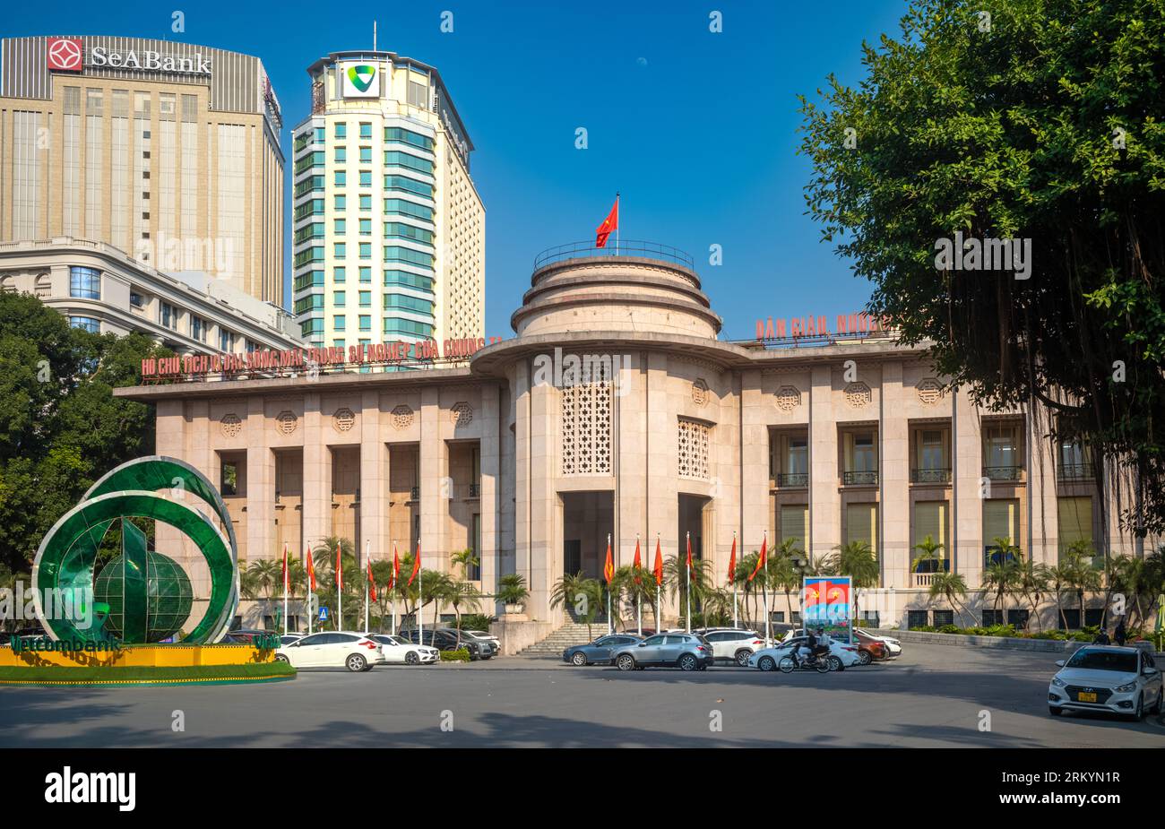 The State Bank of Vietnam seen in the late afternoon with high rise ...