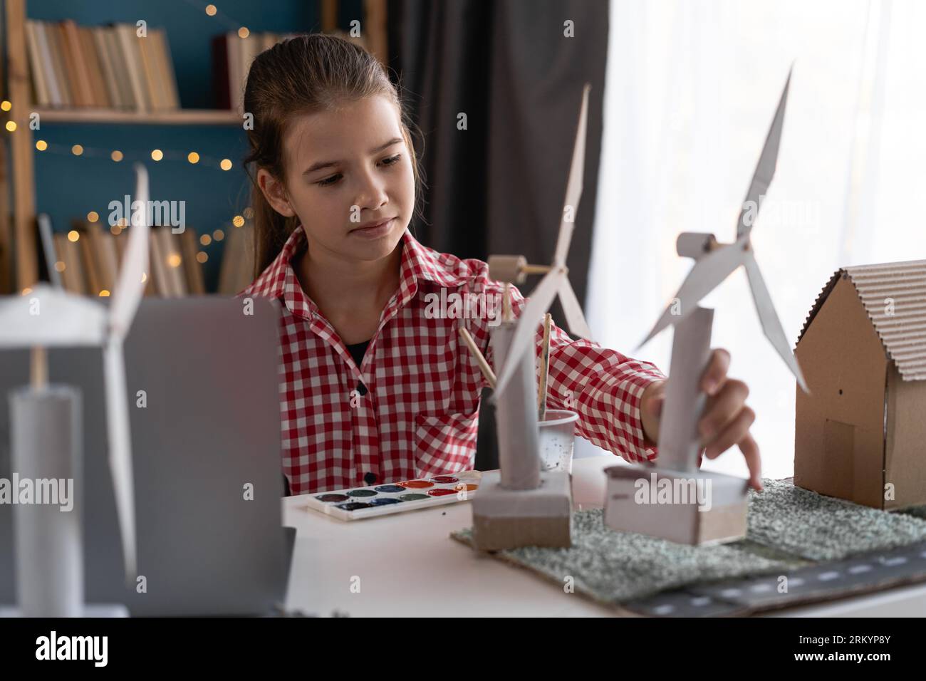 Schoolchild arts, smart child have fun on a handicraft project, using ...