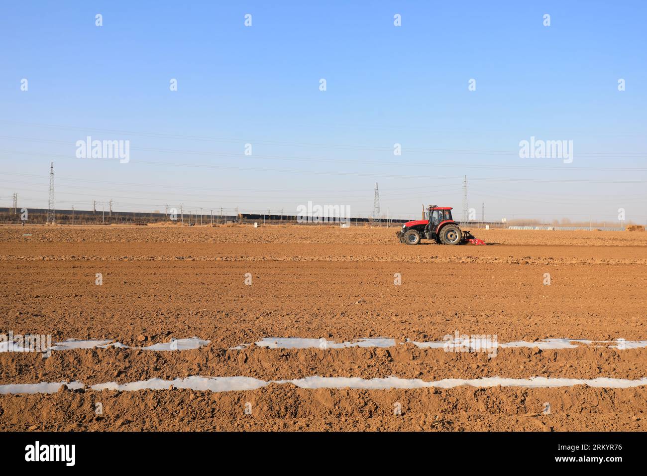 Farmers drive planters to grow potatoes on the farm Stock Photo - Alamy