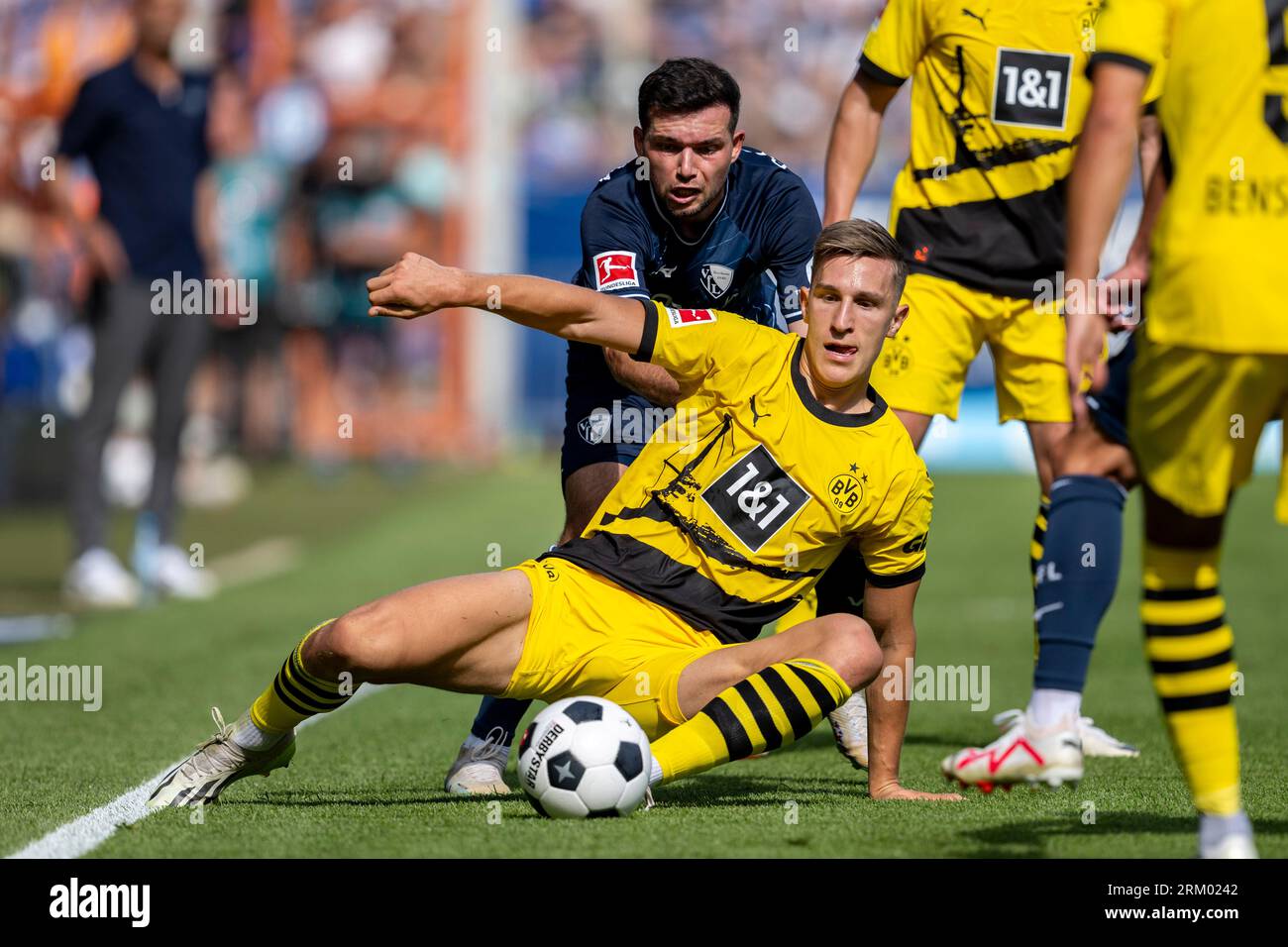 Bochum's Kevin Stoger background centre and Dortmund's Nico ...