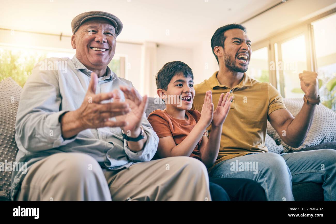 Father, grandfather and child watching tv and celebrate on home sofa ...