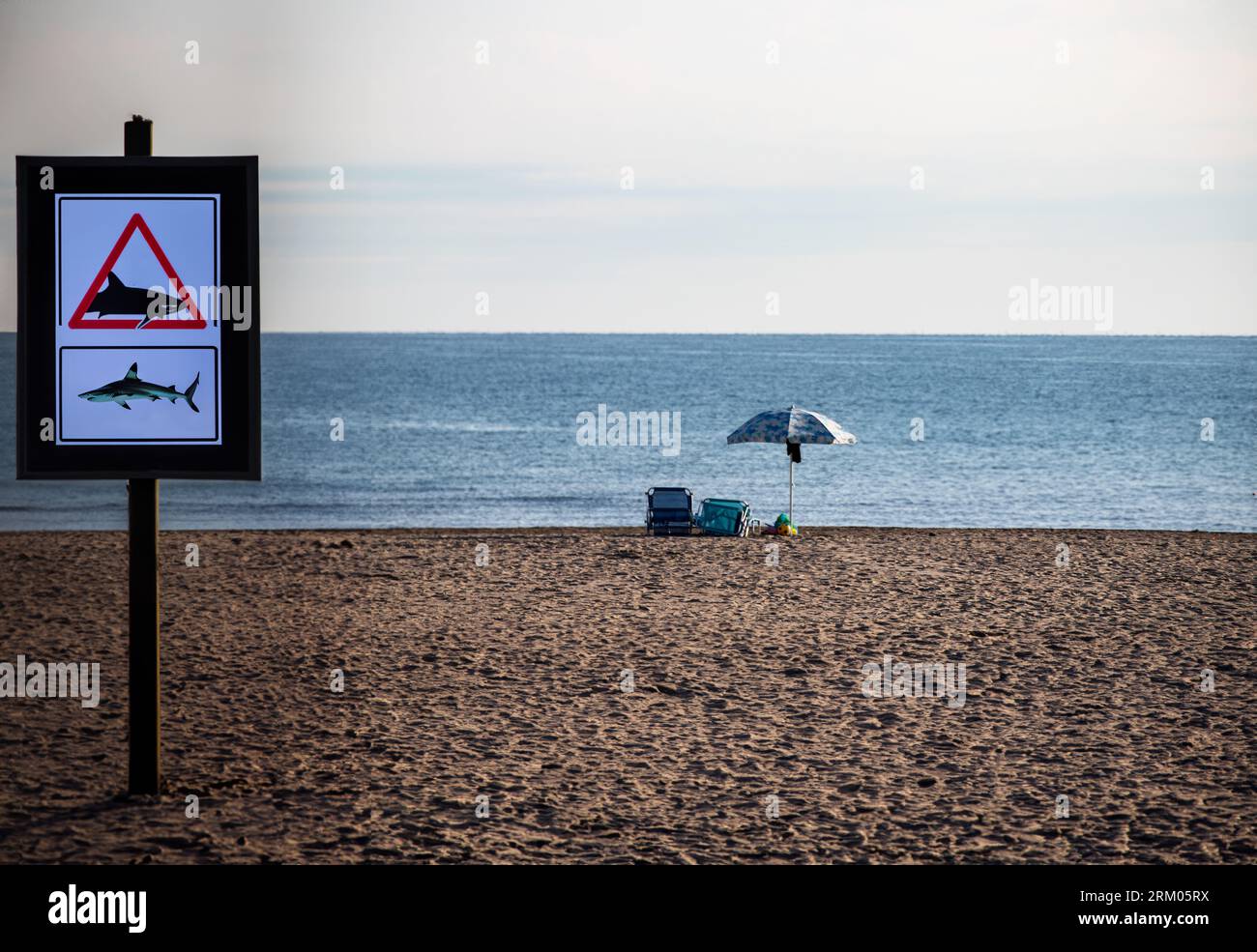 danger sharks seascape sign Stock Photo - Alamy