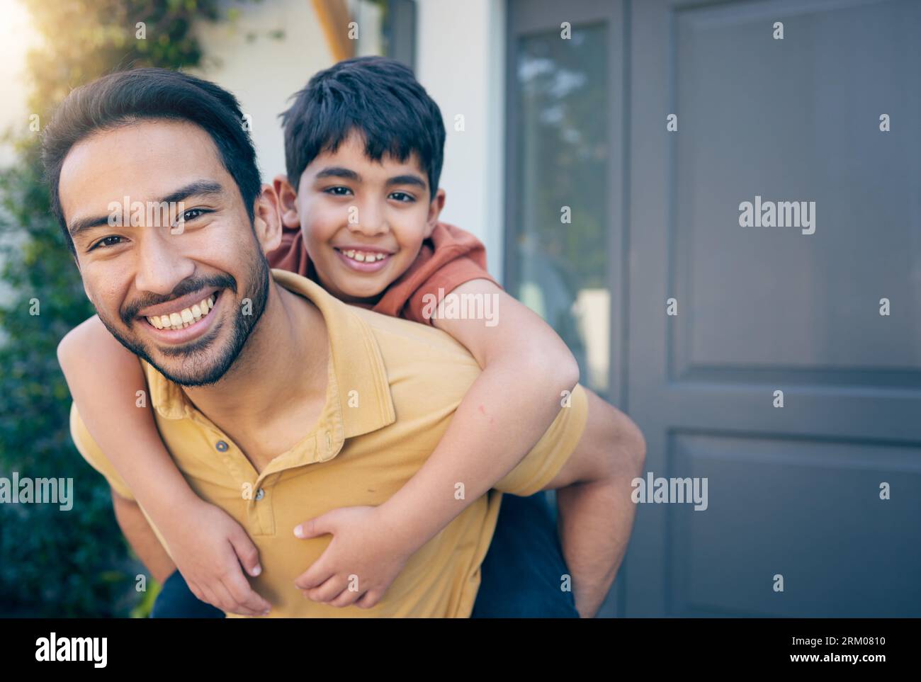 Portrait, smile and father piggyback child by home, bonding and excited ...