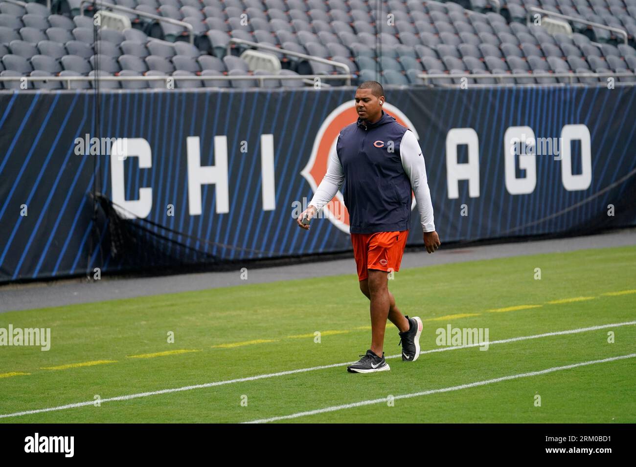Chicago Bears general manager Ryan Poles walks on the field before an ...
