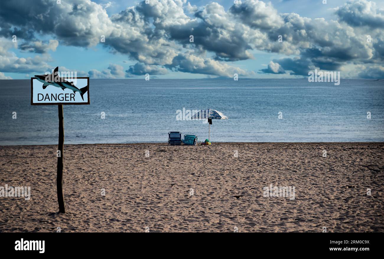danger sharks seascape sign Stock Photo - Alamy