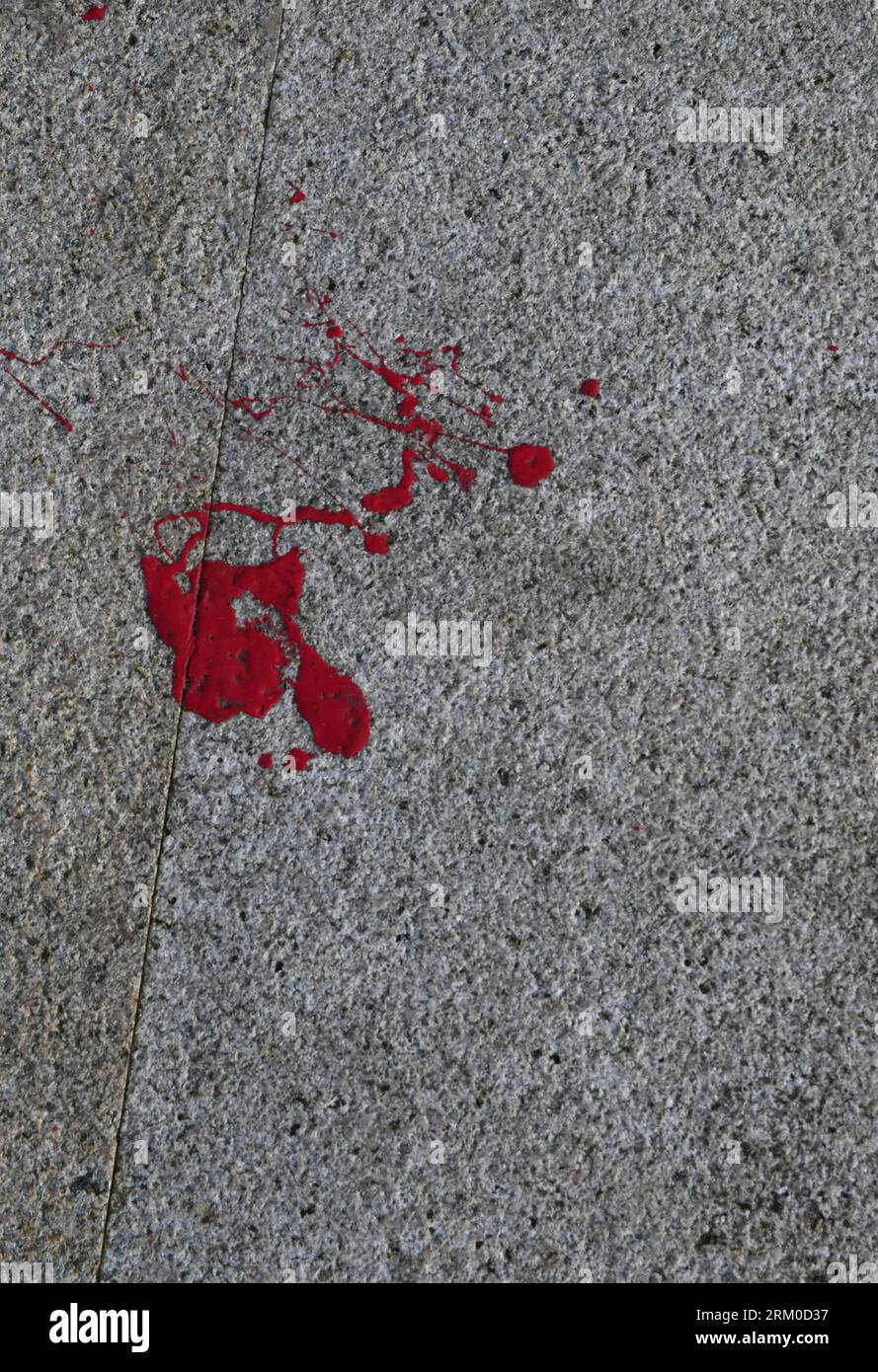 red paint spilt on concret flooring Stock Photo - Alamy