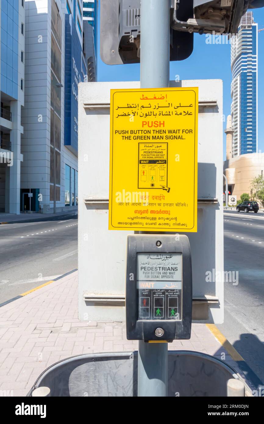 Push button crossing box for pedestrians in Bahrain Bilingual signs ...