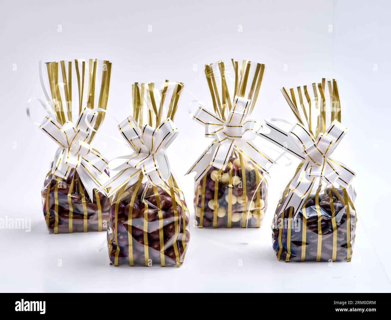 chocolate in mesh bag isolated on white background with a bow tie. rock ...