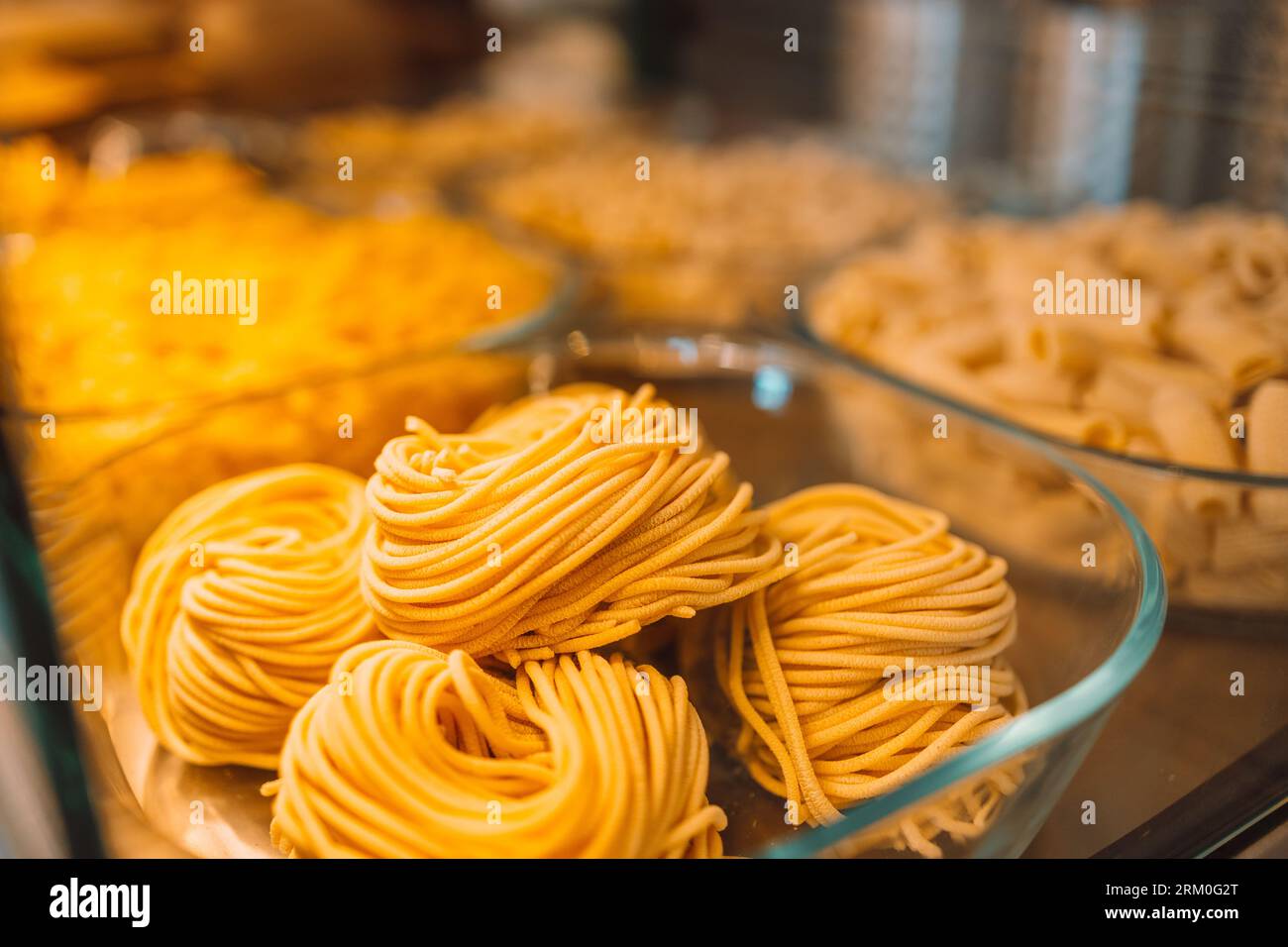 Traditional Italian fresh made colorful organic pasta in shop window ...