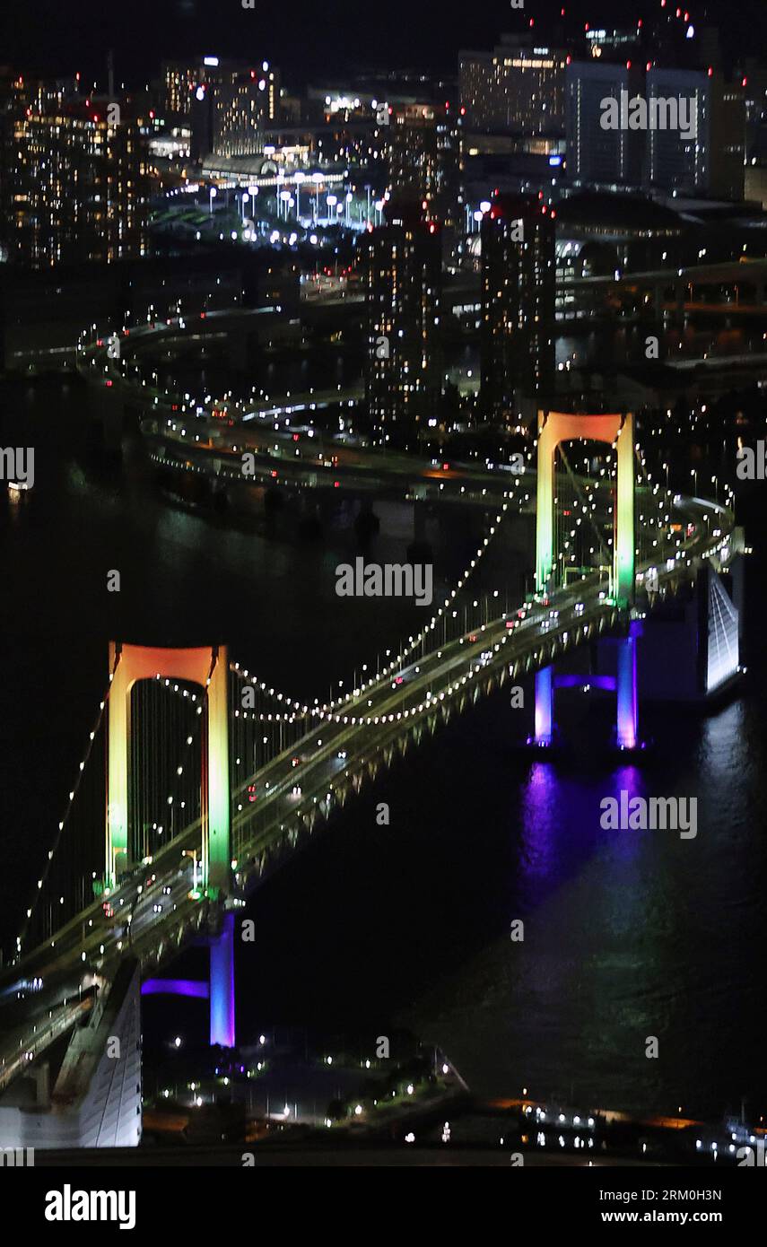 An aerial photo shows the Rainbow Bridge illuminated in a rainbow ...