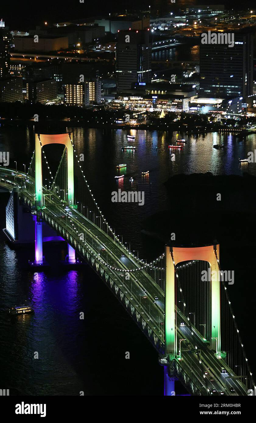 An aerial photo shows the Rainbow Bridge illuminated in a rainbow ...