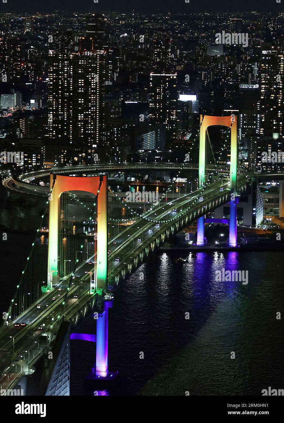 An aerial photo shows the Rainbow Bridge illuminated in a rainbow ...
