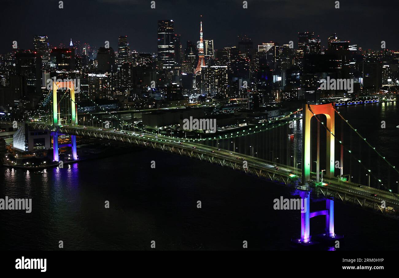 An aerial photo shows the Rainbow Bridge illuminated in a rainbow ...