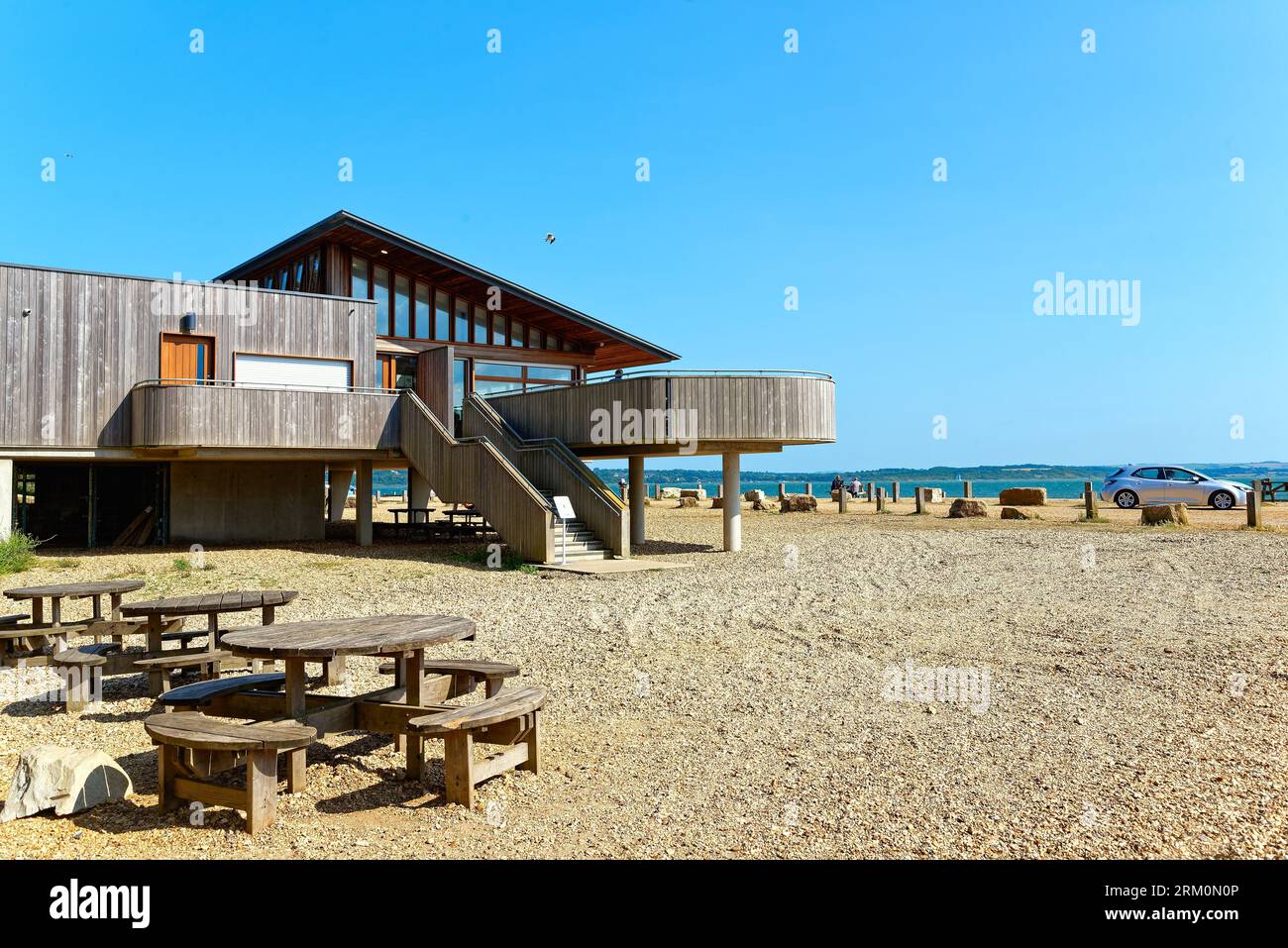 The modernistic café built of wood on the beach at Lepe country park on ...