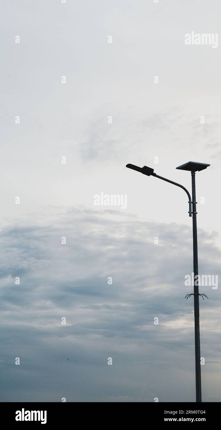 street light isolated with dramatic sky background Stock Photo - Alamy