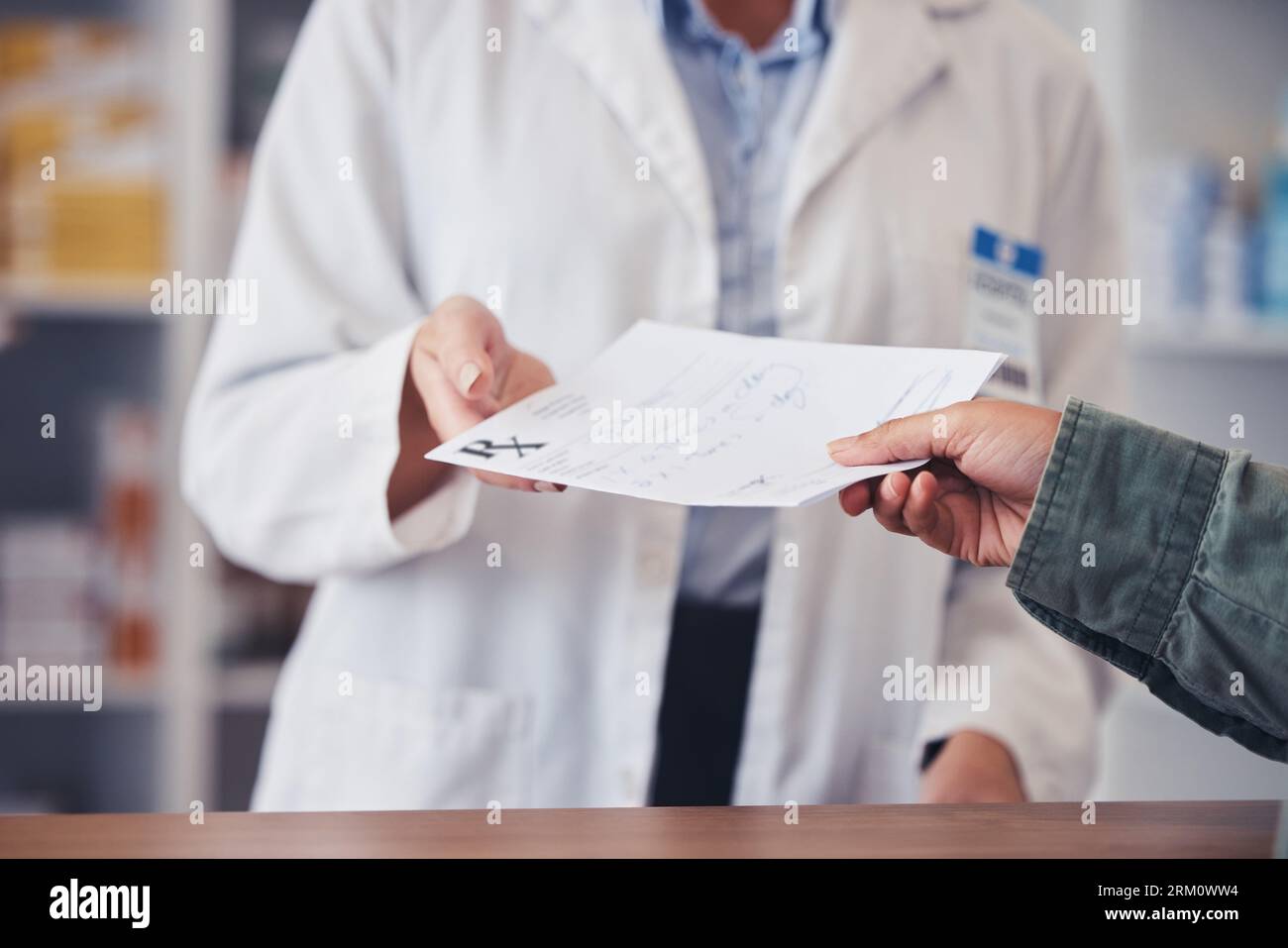 Pharmacy, hands of pharmacist and customer with paper for prescription ...