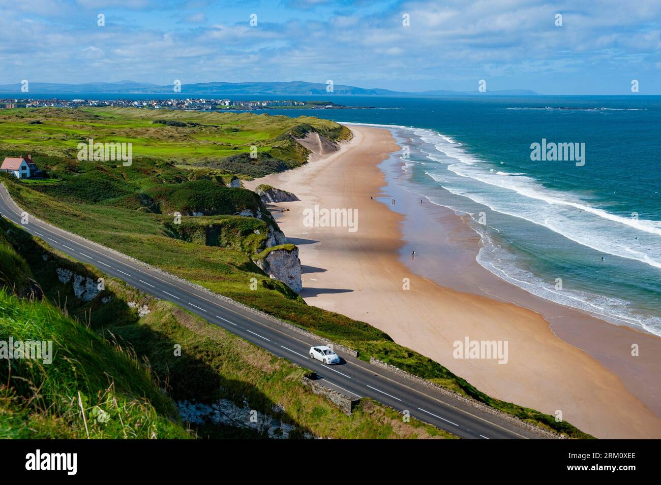 The Causeway coastal road running past the Royal Portrush Golf Club and ...