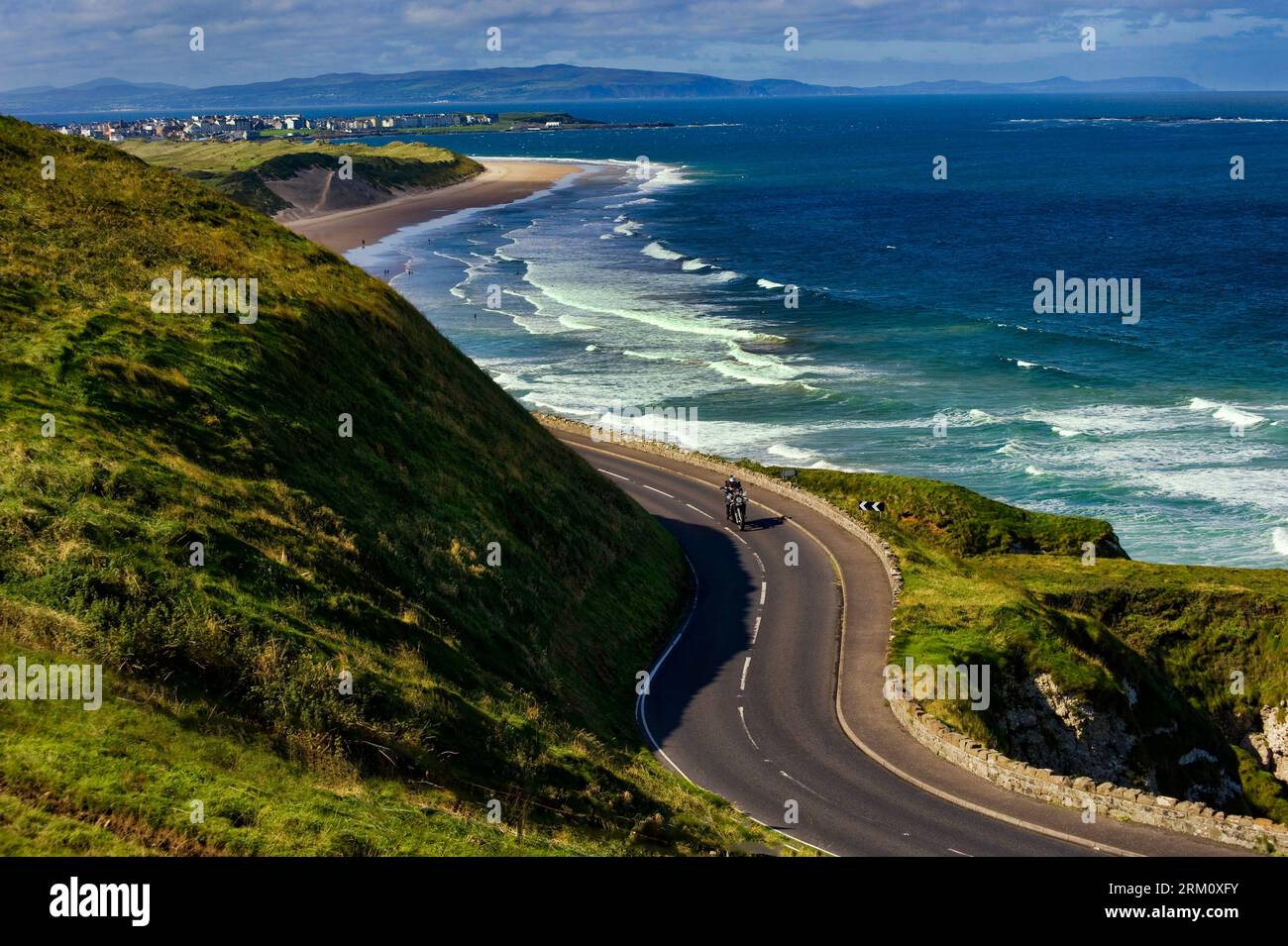 The Causeway coastal road running past the Royal Portrush Golf Club and ...