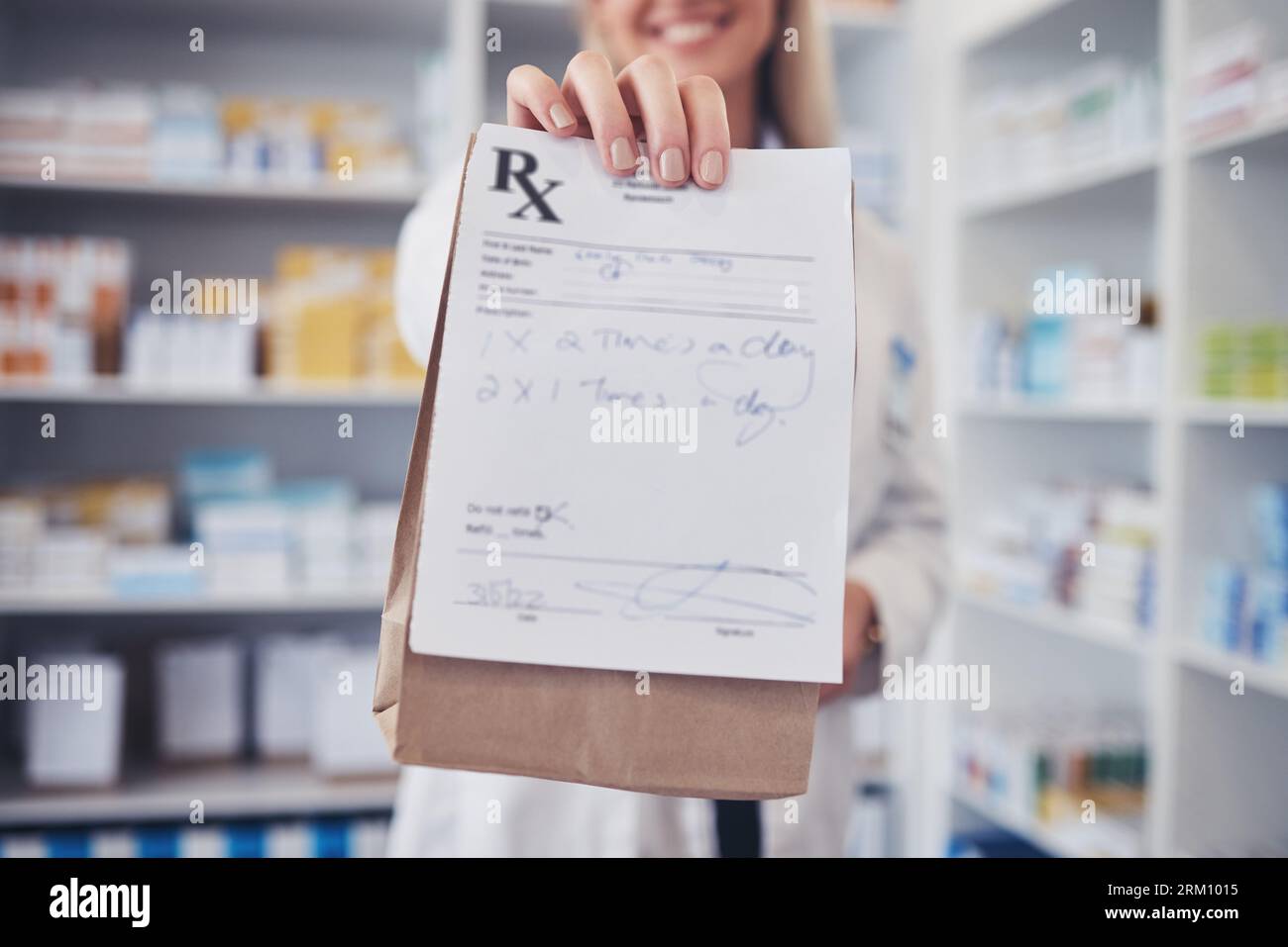 Woman, pharmacist and hand with paper bag for prescription, note or ...