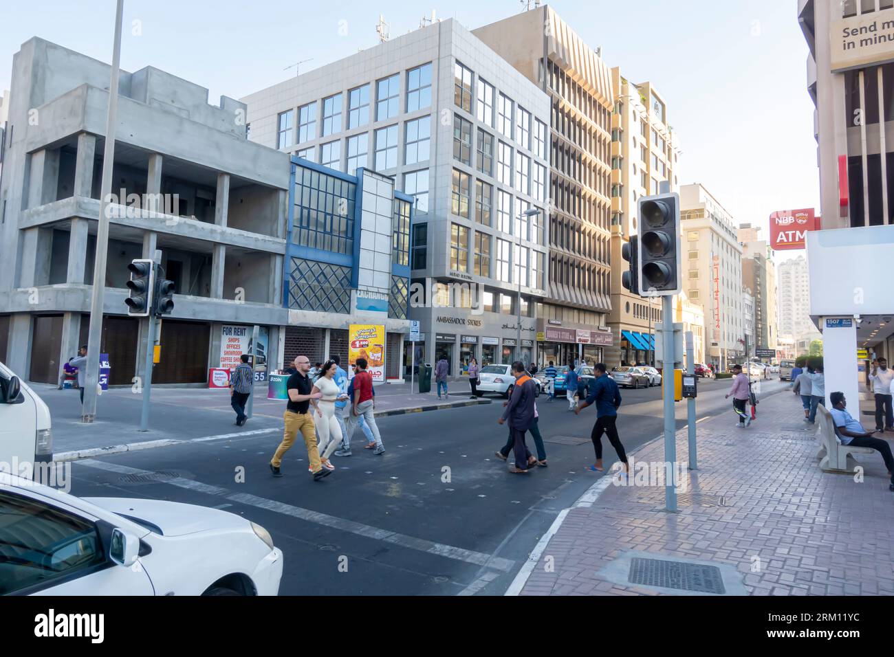 People crossing street in Manama Bahrain, pedestrians cross street in ...