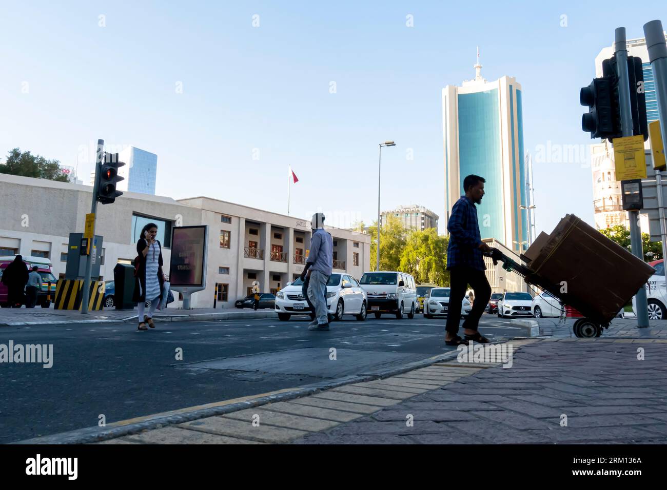 People crossing street in Manama Bahrain, pedestrians cross street in ...