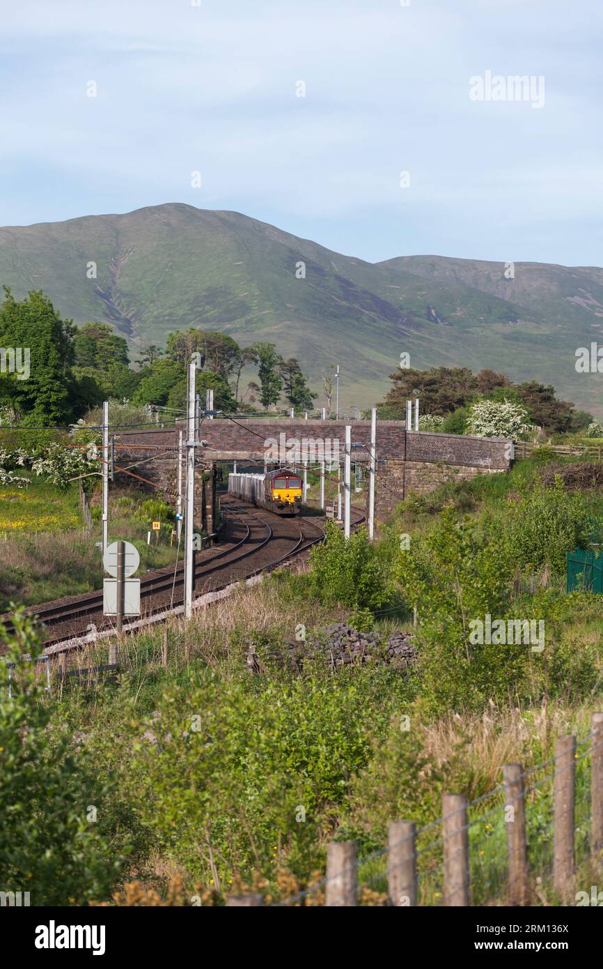 DB Cargo class 66 locomotive in EWS livery passing Grayrigg (north of ...