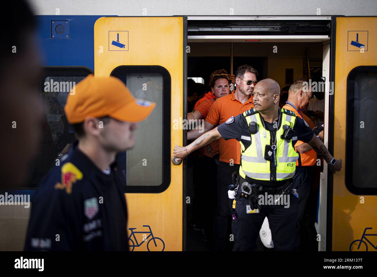 ZANDVOORT - Visitors leave Zandvoort by train after Max Verstappen came ...