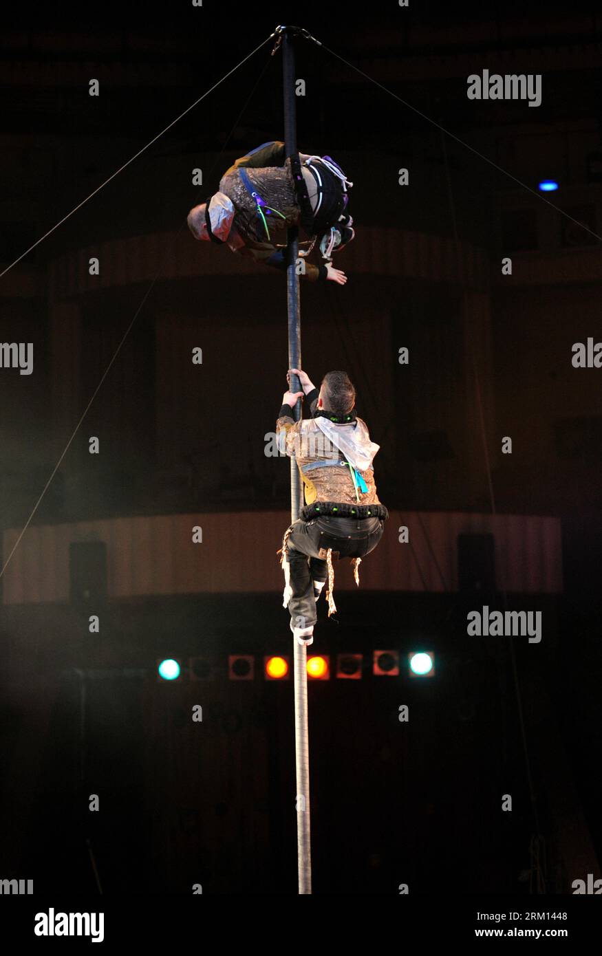 Pylon artists of the National Circus of Ukraine performing risky trick ...