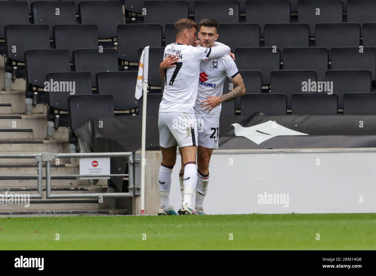 Daniel Harvie celebrates after scoring for Milton Keynes Dons, to take ...