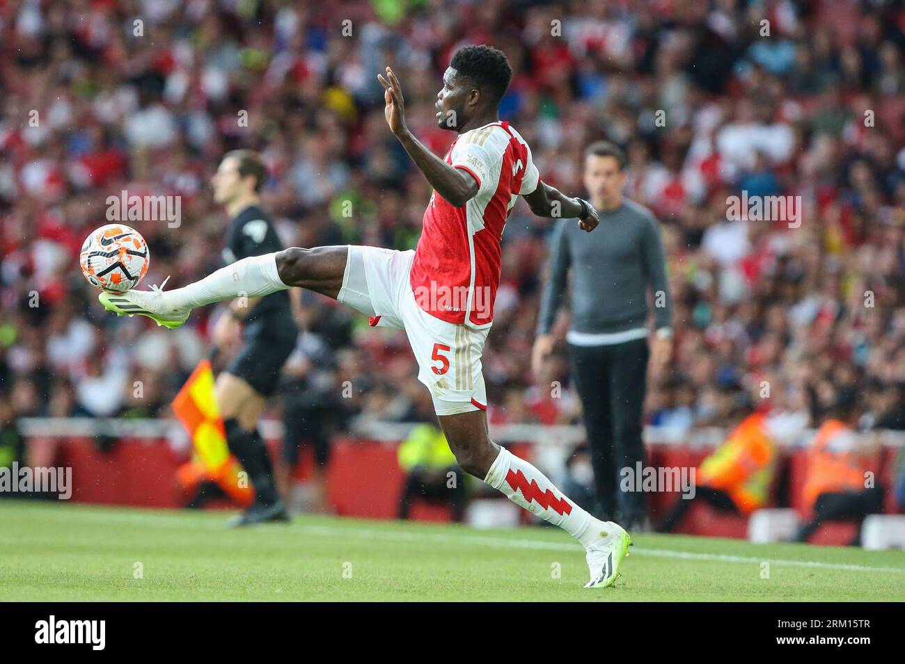 Thomas Partey #5 of Arsenal controls the ball during the Premier League ...