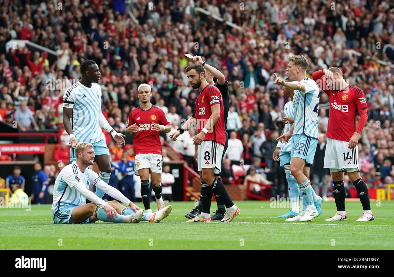 Nottingham Forest's Joe Worrall is shown a red card by referee Stuart ...