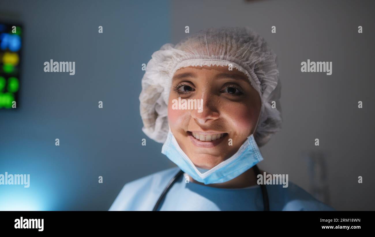 Doctor takes off his surgical mask Stock Photo - Alamy