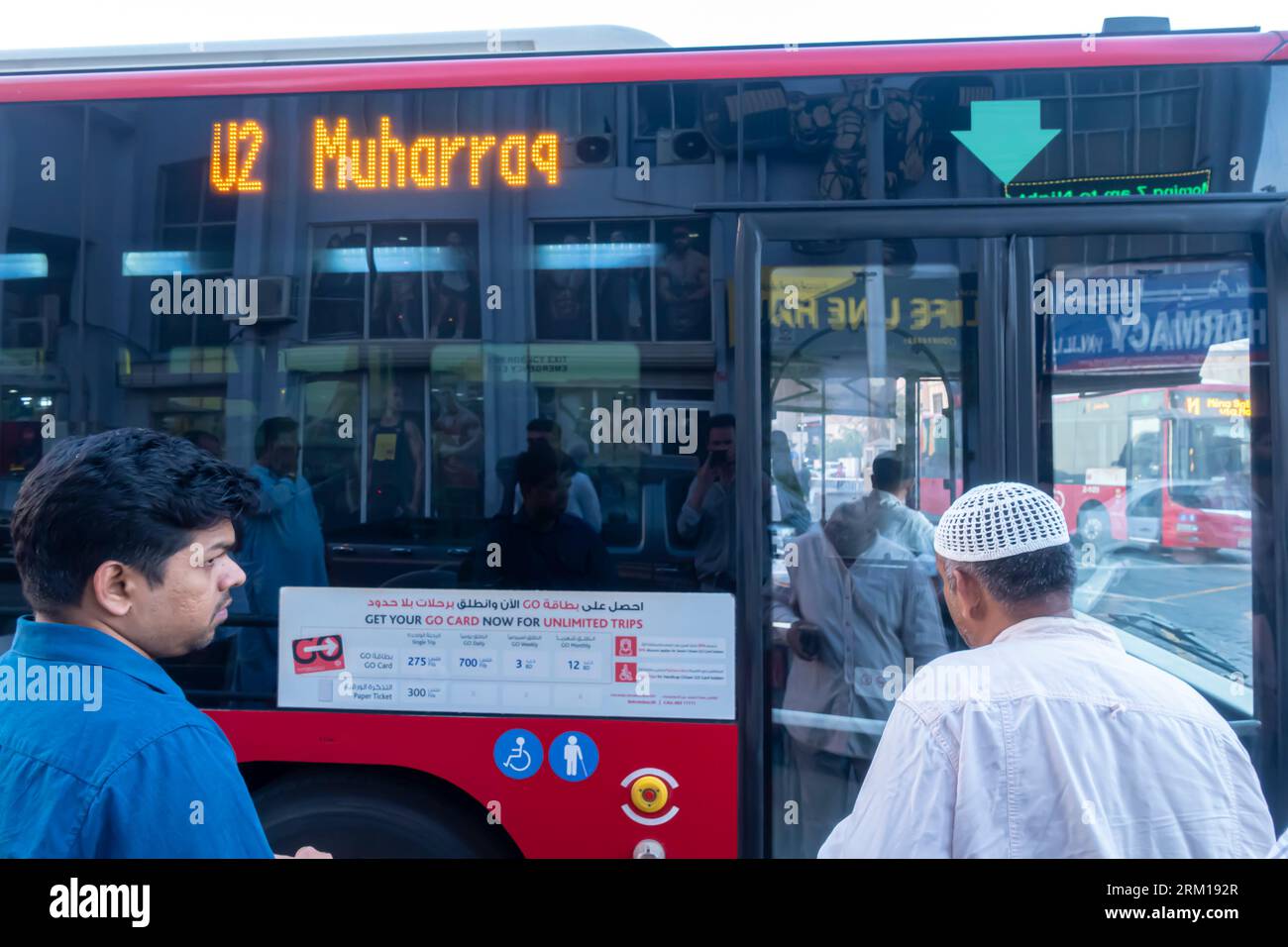 Public bus, commuters at Central public bus station in Manama Bahrain ...