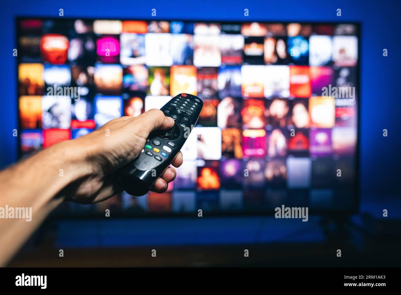 Remote control pointing at a TV Stock Photo - Alamy