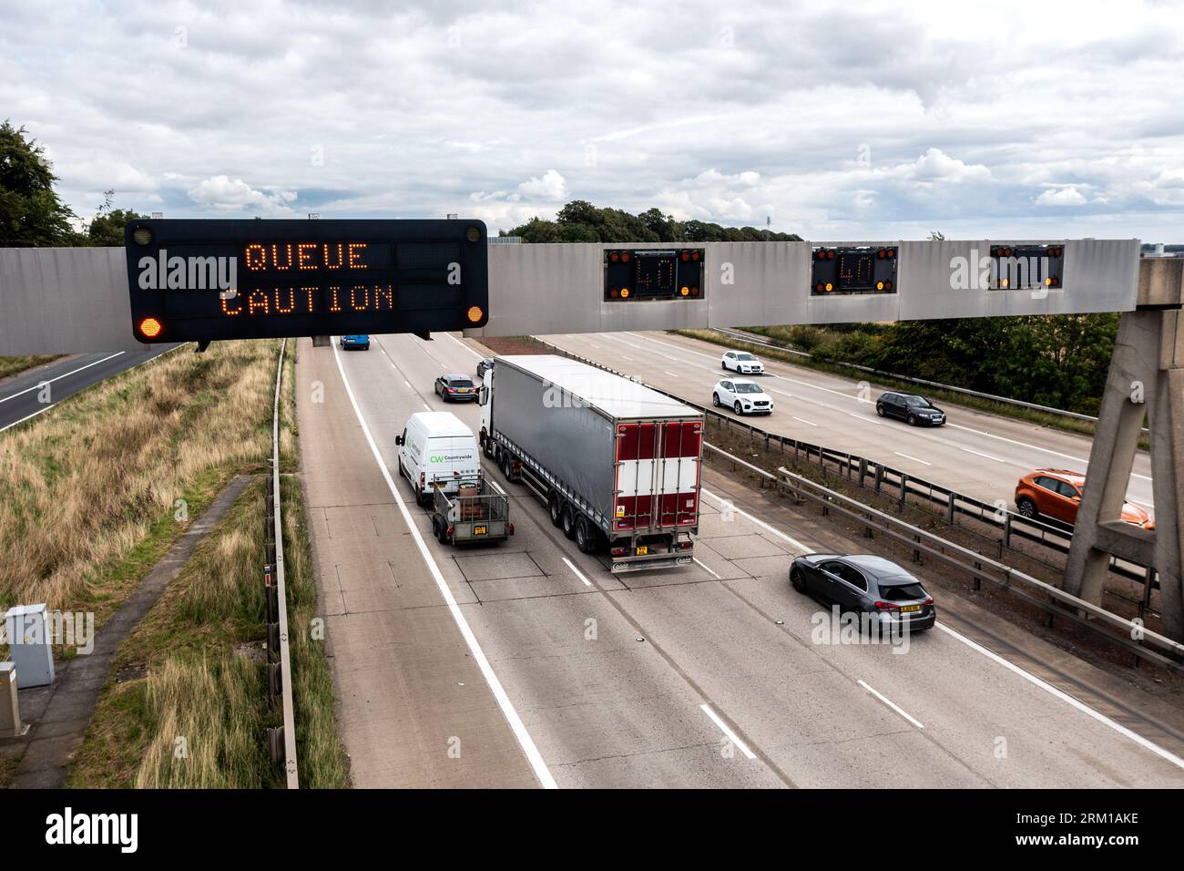 LEEDS, UK - AUGUST 25, 2023. An overhead warning sign on a busy UK ...