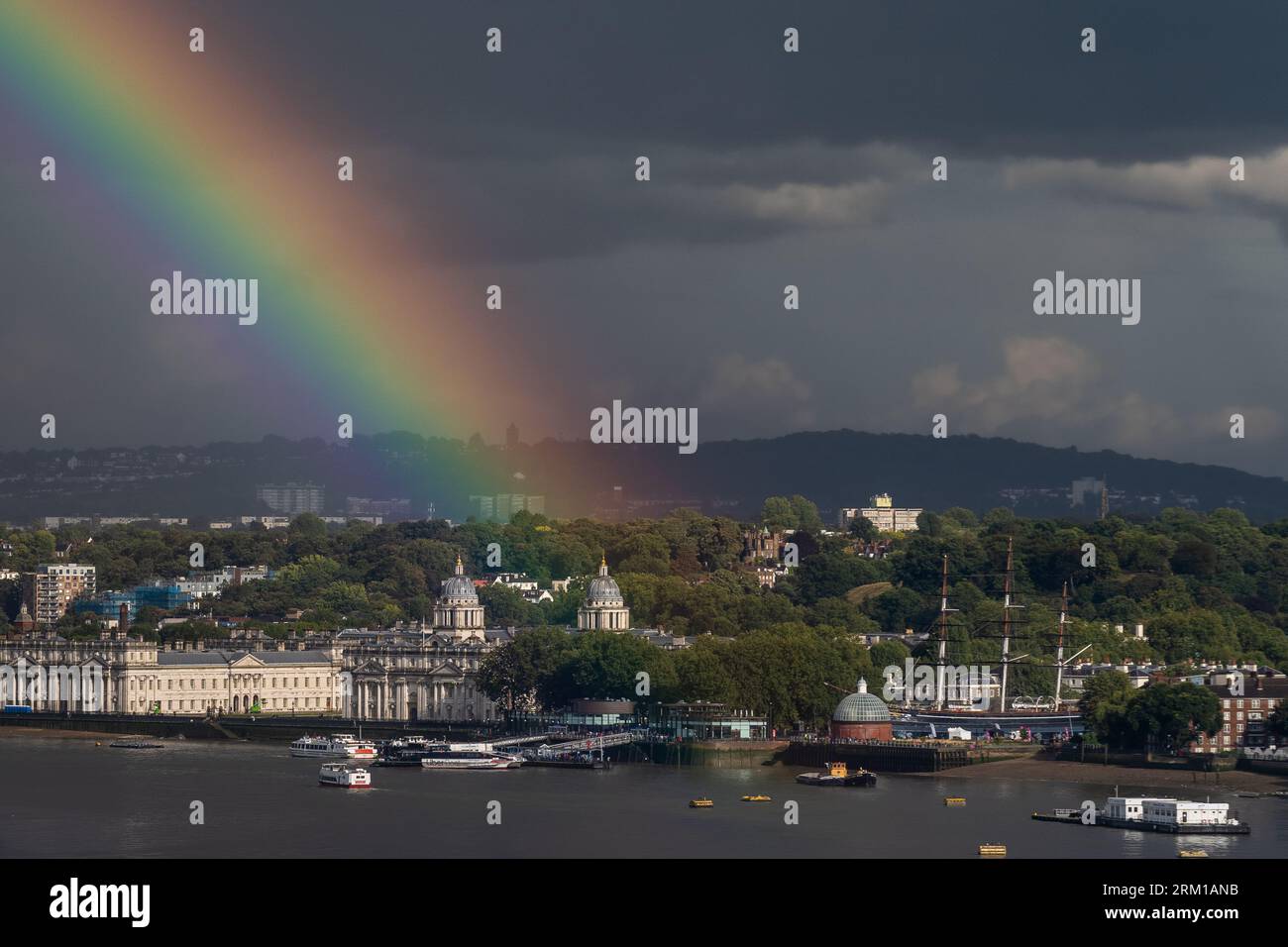 London, UK. 26th August, 2023. UK Weather: A massive rainbow breaks ...