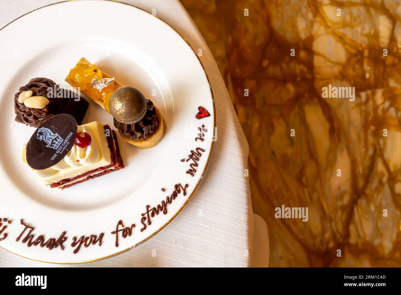 Welcome dessert plate in Gourmet Lounge Ritz hotel Bahrain Stock Photo ...