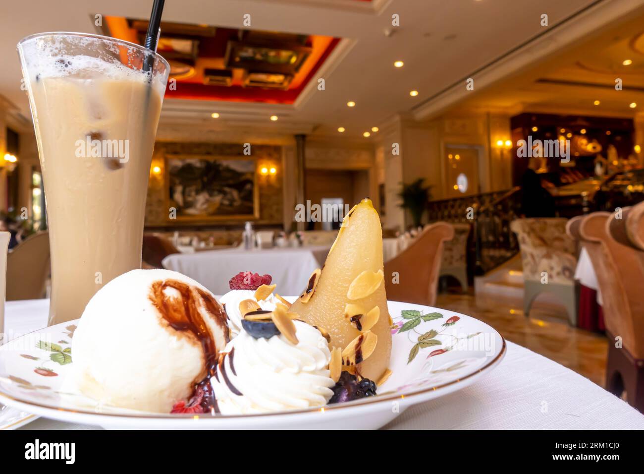 Belle Helen, a dessert made from pears poached in sugar syrup and ...