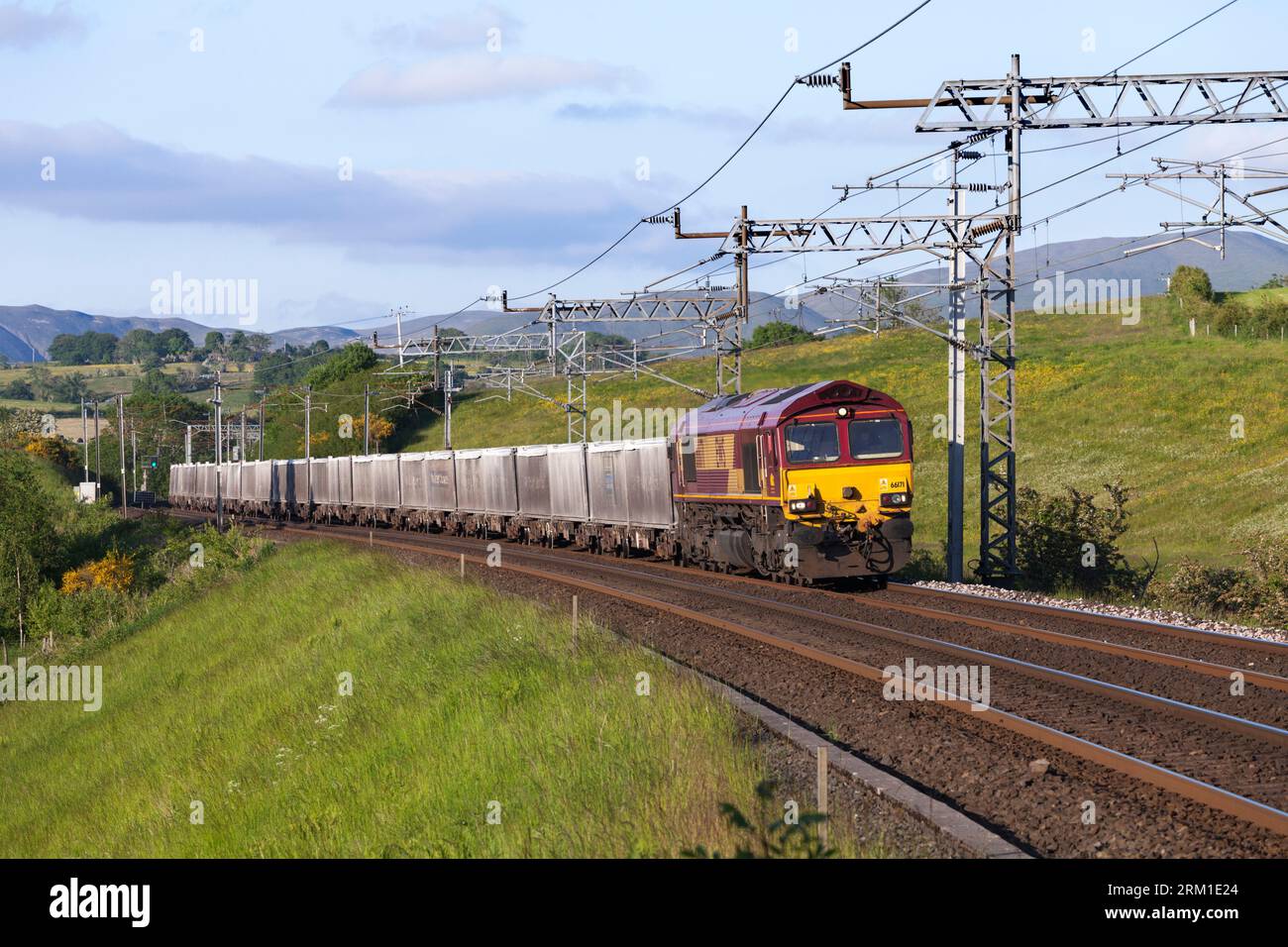 DB Cargo class 66 locomotive in EWS livery passing Lambrigg (north of ...
