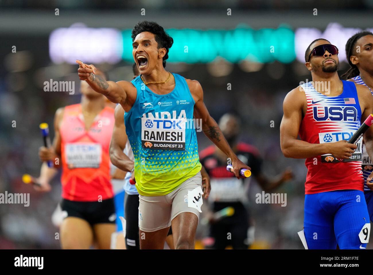 Rajesh Ramesh, of India celebrates after placing second in a Men's ...