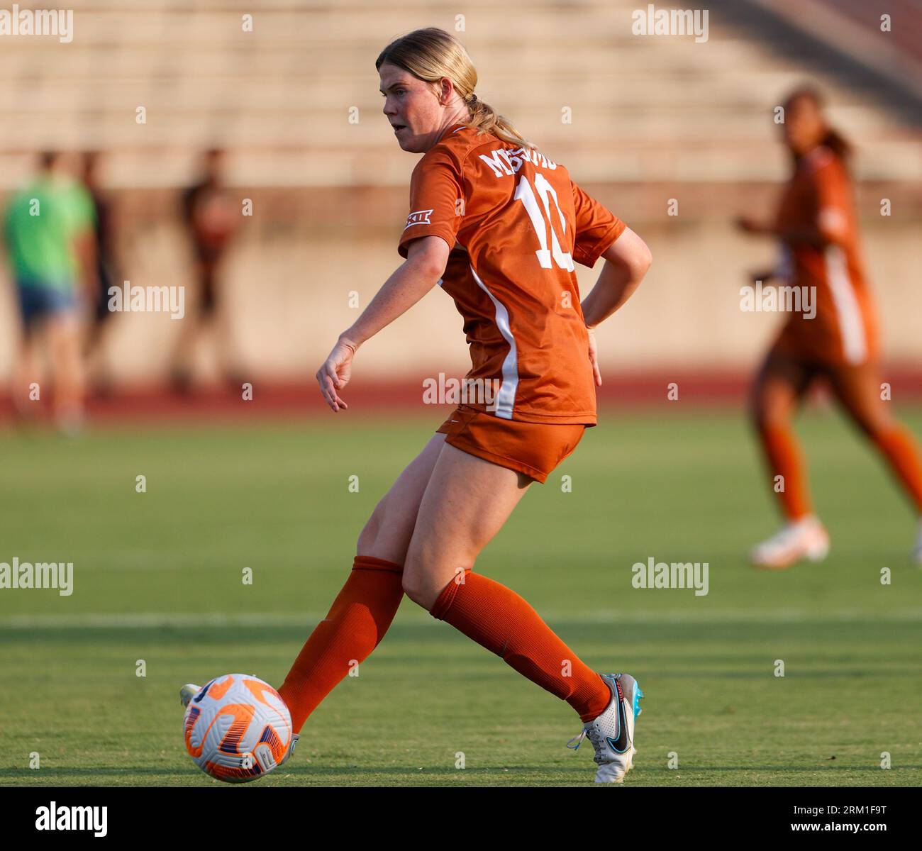 August 24, 2023: Texas midfielder Lexi Missimo (10) lines up a shot on ...