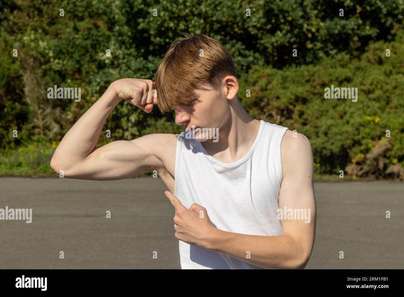 Muscular teen biceps hi-res stock photography and images - Alamy