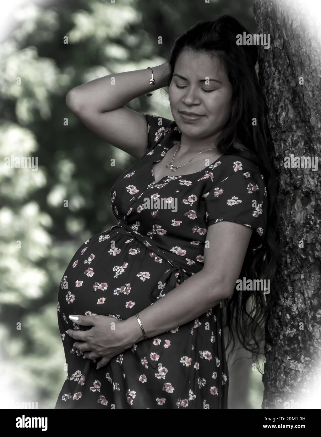 Black and White Photo of a Mexican mother outside posing with her belly ...