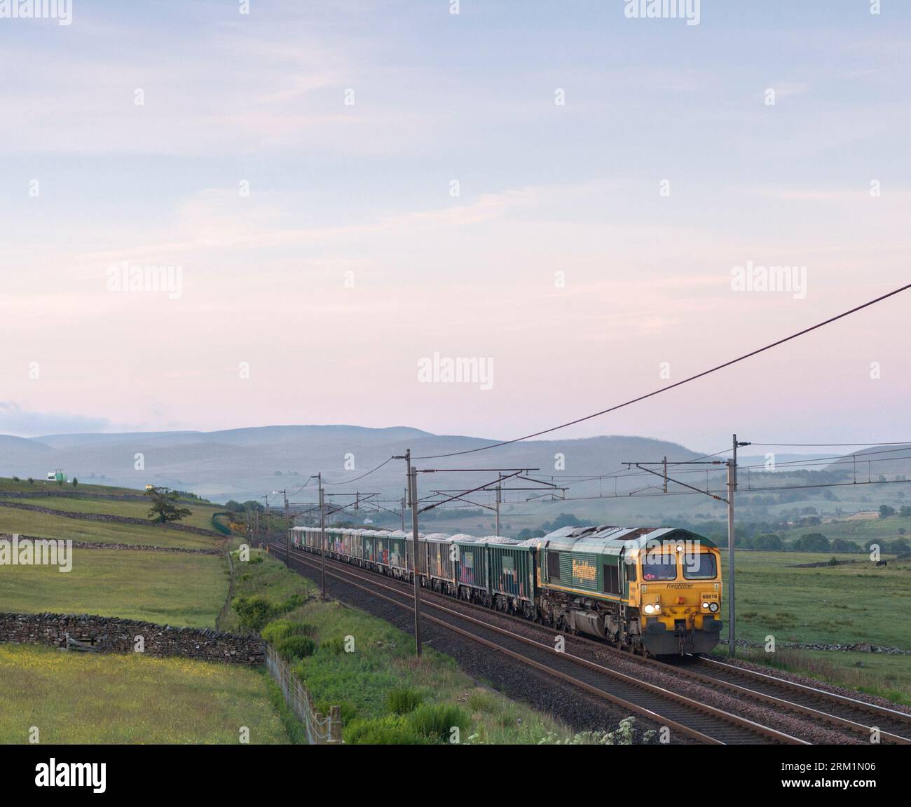 A Freightliner Class 66 locomotive climbing Shap bank, on the west ...