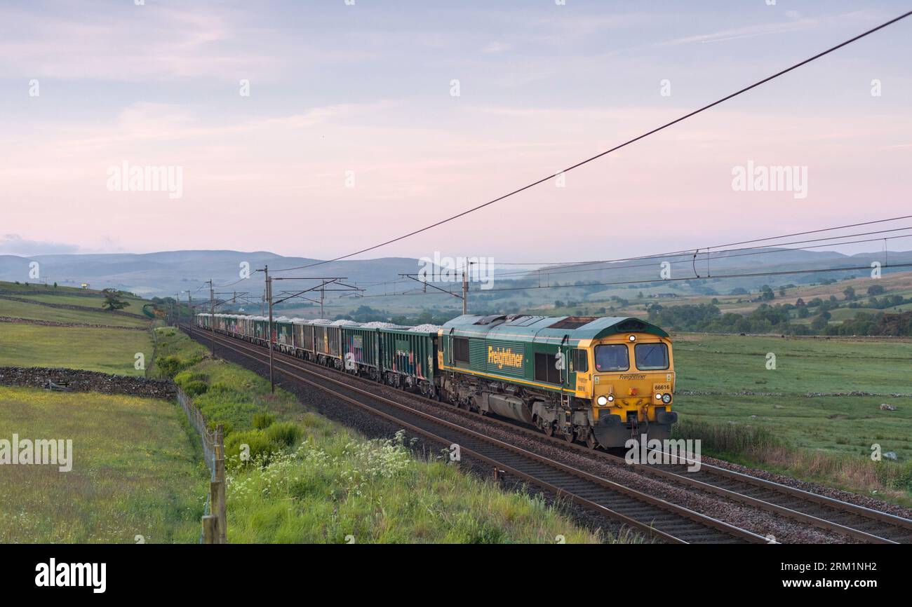A Freightliner Class 66 locomotive climbing Shap bank, on the west ...