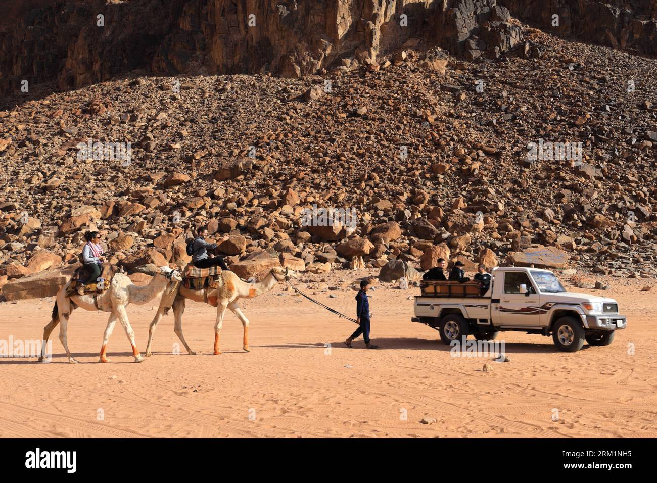 Tourists at Lawrence's Spring, Wadi Rum, Jordan, Middle East Stock ...