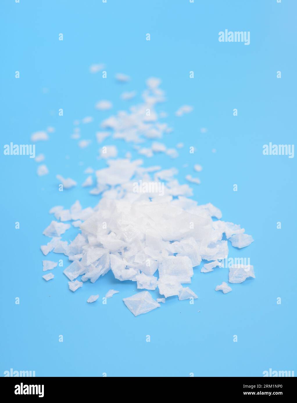 Pyramide Crystal Flakes of Cyprus Salt on blue background Stock Photo ...