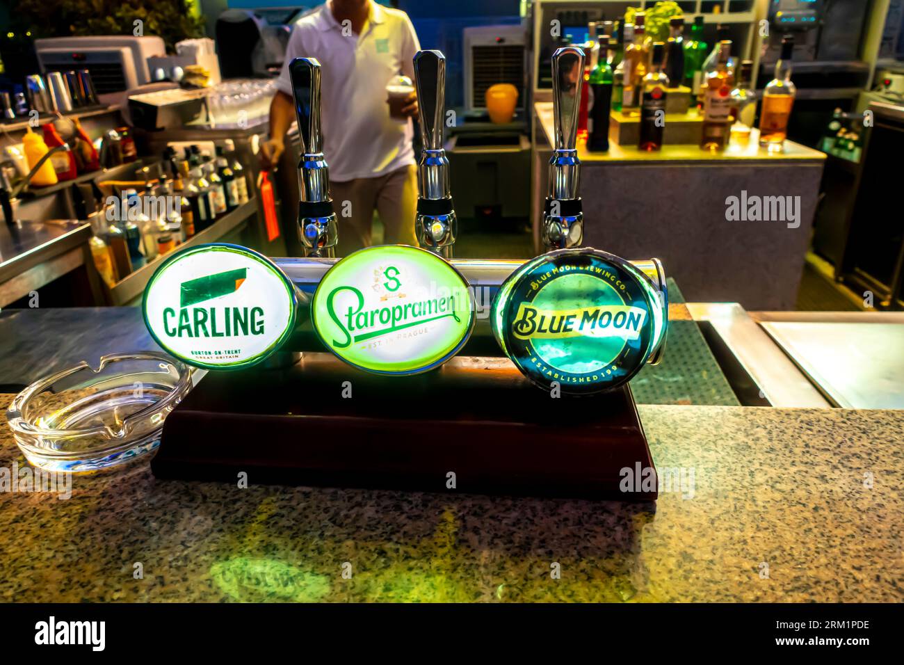 Carling, Staropramen, Blue Moon beer cranes in bar Stock Photo - Alamy
