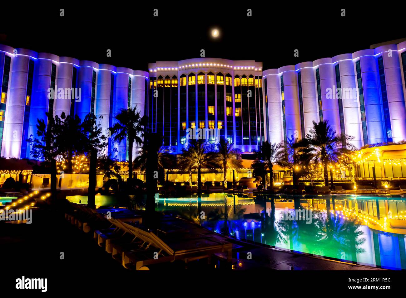 The Ritz-Carlton Bahrain, lit at night.View from the pools area, resort ...